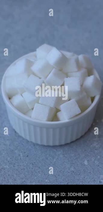 Sweet white sugar cubes as a source of glucose. White sugar cubes as a ...