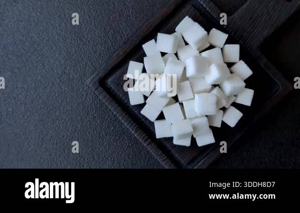 Sweet white sugar cubes as a source of glucose. White sugar cubes as a ...