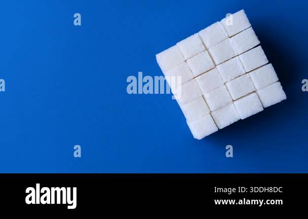 Sweet white sugar cubes as a source of glucose. White sugar cubes as a ...