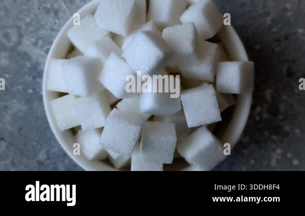 Sweet white sugar cubes as a source of glucose. White sugar cubes as a ...