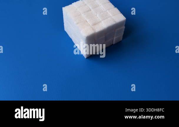 Sweet white sugar cubes as a source of glucose. White sugar cubes as a ...