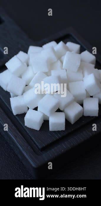 Sweet white sugar cubes as a source of glucose. White sugar cubes as a ...