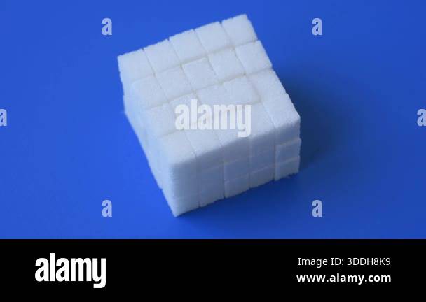 Sweet white sugar cubes as a source of glucose. White sugar cubes as a ...