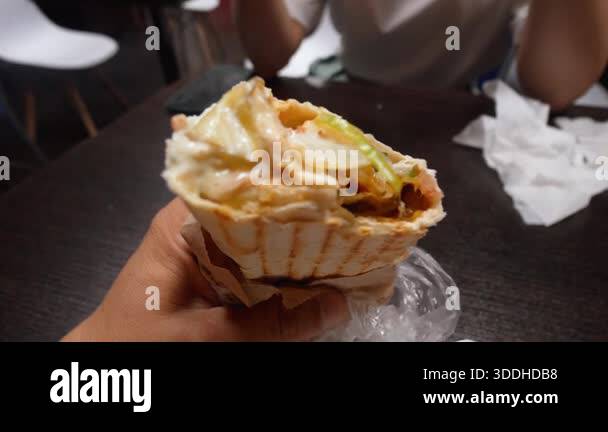 Close-up point of view shot of a person's hand holding a delicious ...