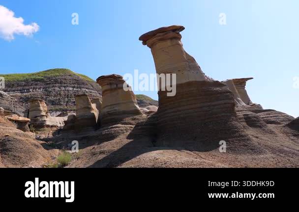 Sunlight illuminates the unique hoodoo rock formations in drumheller ...