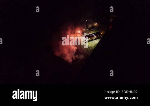 On news fire incident in night city. Aerial drone shot firefighters ...