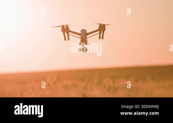 Amazing view of flying copter drone scanning agricultural landscape ...