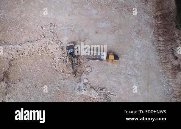 Top view of vehicles at quarry. Aerial drone footage of crawler ...