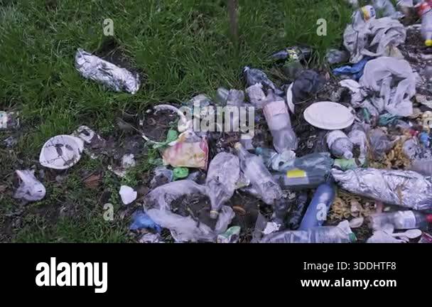 Assorted household refuse and non-biodegradable waste accumulate on the ...