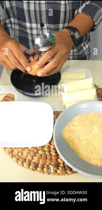 Man Cracking and Whisking Egg Yolk for Food Breading Process Stock ...