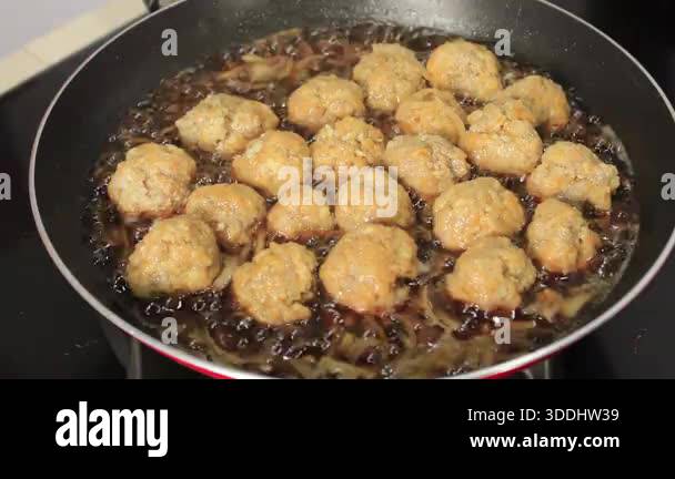 Delicious Meatballs Cooking in a Savory Sauce Stock Video Footage - Alamy