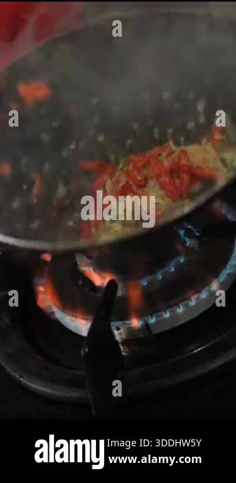Professional Chef Sauting Spicy Aromatics with Flamb Fire Effect Stock ...