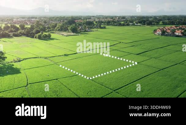 Aerial view of vacant land plot marked with location pin in green field ...