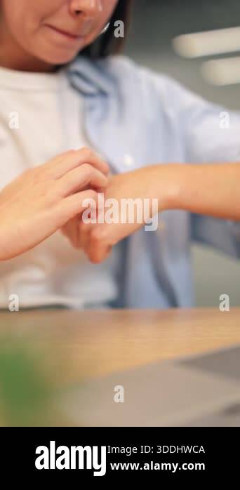 Close-up shows person experiencing uncomfortable itchy sensation on ...