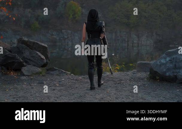 unrecognizable silhouette person fantasy woman warrior assassin holds ...