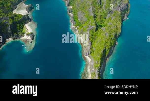 Blue sea between Tapiutan Island and Matinloc Island. White sandy beach ...