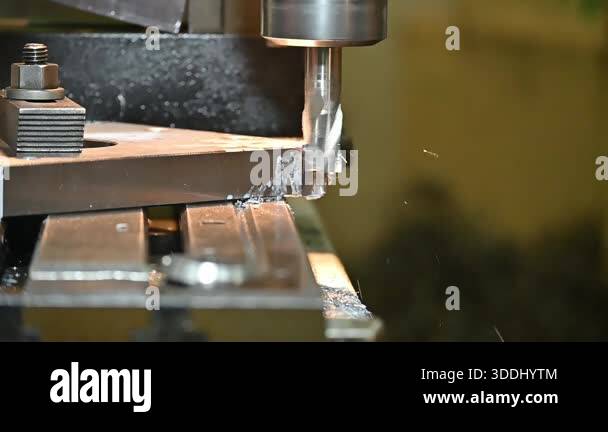 Slow motion scene plunge milling process the metal plate parts on NC ...