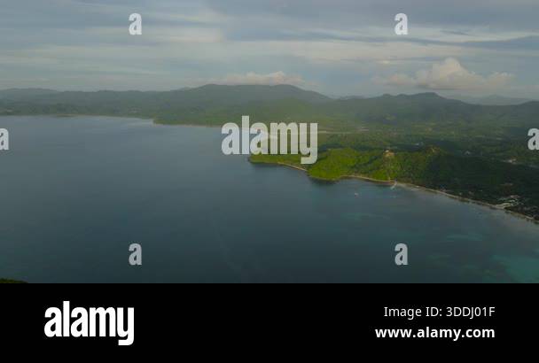 Tropical Island with beaches. Boats near the coastline and blue sea. El ...