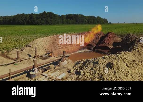 Drone shooting of pit with burning fire near enterprise. Industrial ...