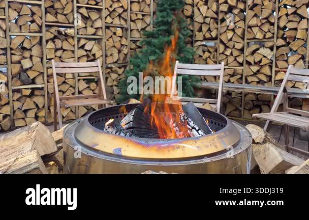 Cozy Outdoor Fire Pit Area With Seating and Neatly Arranged Wood ...