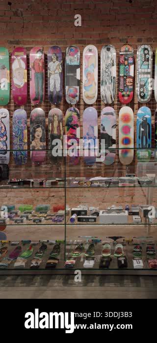 Skateboard shop interior with colorful decks and merchandise displayed ...