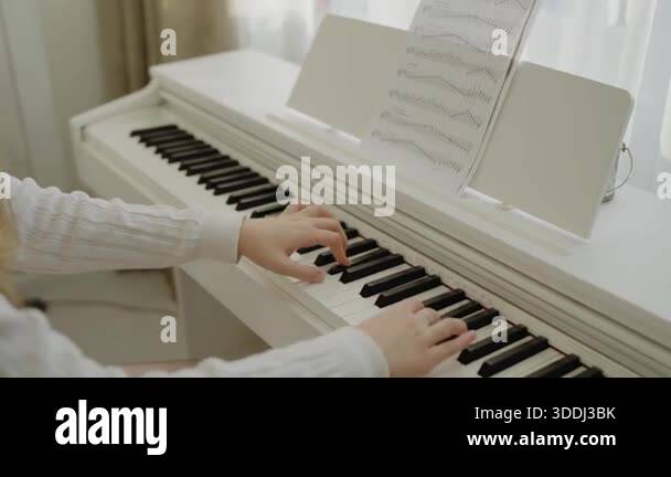 Teenage girl practicing piano at home. Study and learning development ...