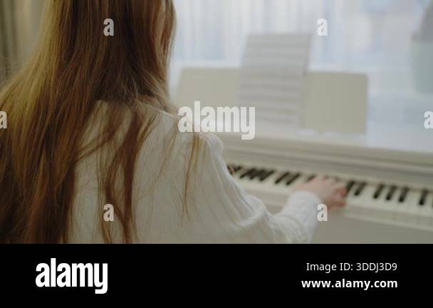 Teenage girl practicing piano at home. Home music studio woman. music ...