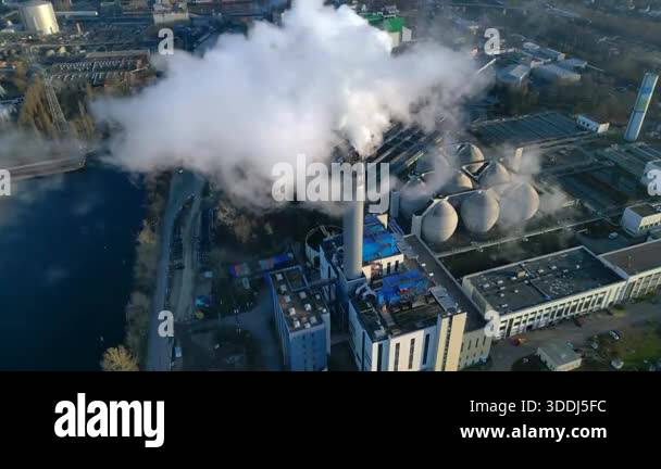 Industrial chimneys releasing large plumes of smoke pollution into the ...