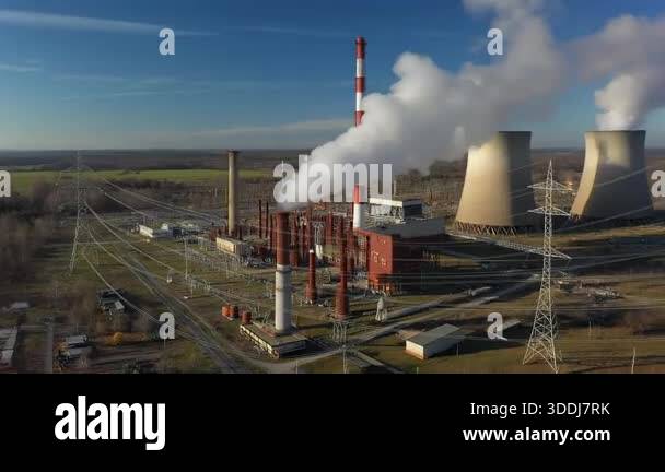 A factory or power plant as a symbol of industry and electricity ...