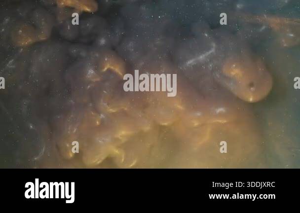 Underwater glitter splash. Paint cloud wave. Defocused purple blue ...