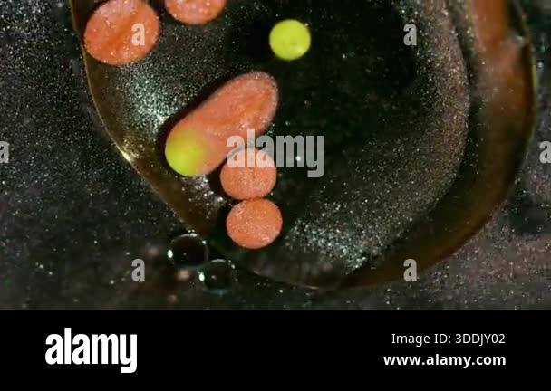 Shiny paint. Glitter oil. Blur orange yellow purple color sparkling ...