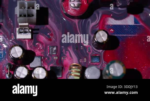 Ink spill. Electronic microchip. Defocused red blue white colorful ...