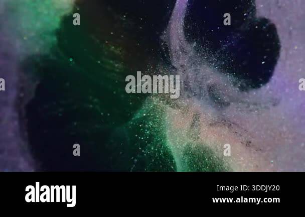 Paint splatter. Ink splash. Defocused purple green yellow colorful ...