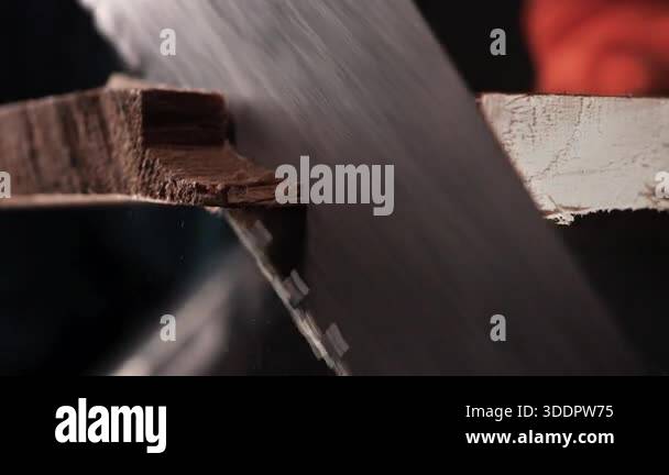 Macro DOF of a sharp hand saw blade cutting a wooden board. wood ...