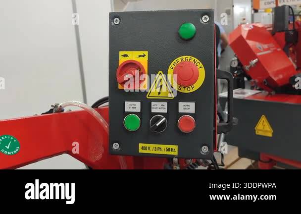 Industrial equipment control panel with several buttons and switches ...