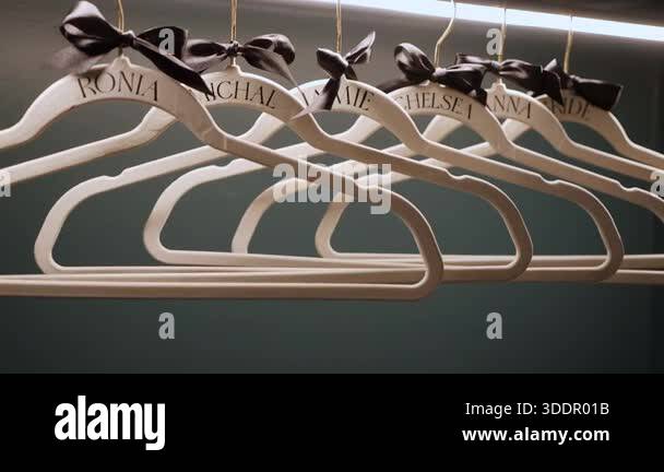 Empty Wooden Hangers Under LED Light, Row Of Unoccupied Hangers ...