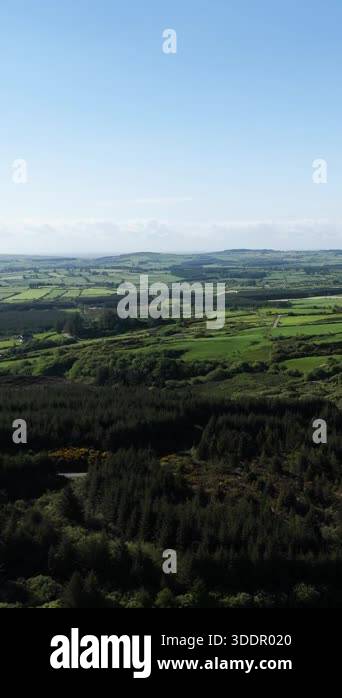 Scenic morning in rural Ireland presents beautiful green fields and ...