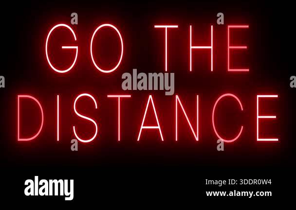 Flickering red retro style neon sign glowing against a black background ...