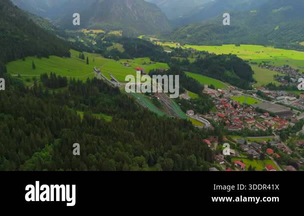 Aerial view of Oberstdorf in Allgau Alps and ORLEN Ski Jump Arena. This ...