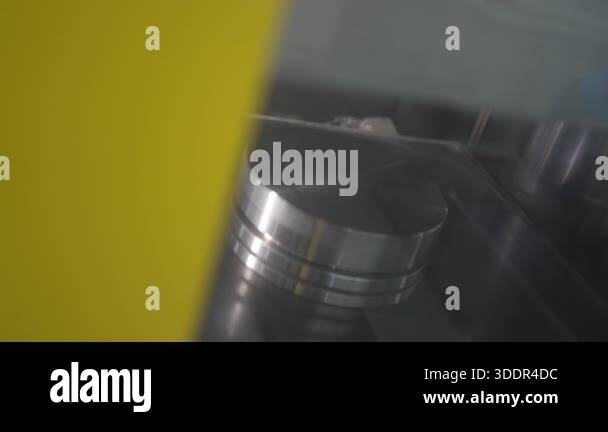 Circular metal blade lies into molding machine chamber on rubber sheet ...