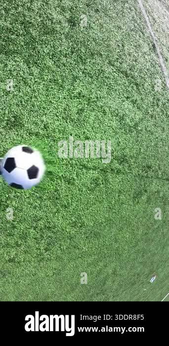 First person perspective of a soccer player kicking the ball on a green ...