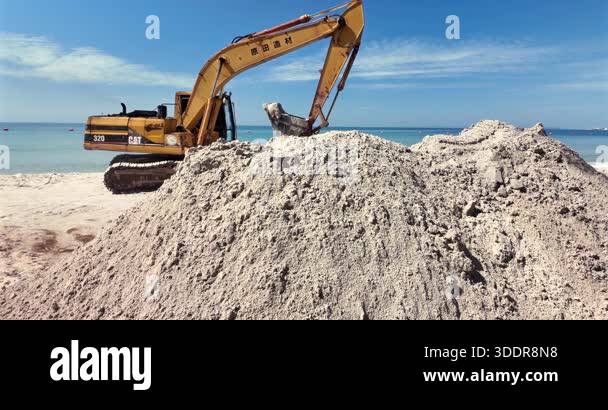 Sihanoukville- cambodia. 09- 12 2025. Excavator digging sand on a beach ...