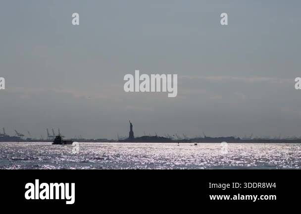 Sunlit Harbor Skyline Statue Silhouette Small Fishing Boat And Ferry ...