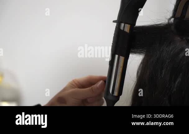 Stylist Curling Long Hair With Curling Iron CloseUp Hands Wrapping ...