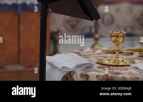 Golden Chalice On Altar Table, Ornate Paten And Folded Linen Beside ...