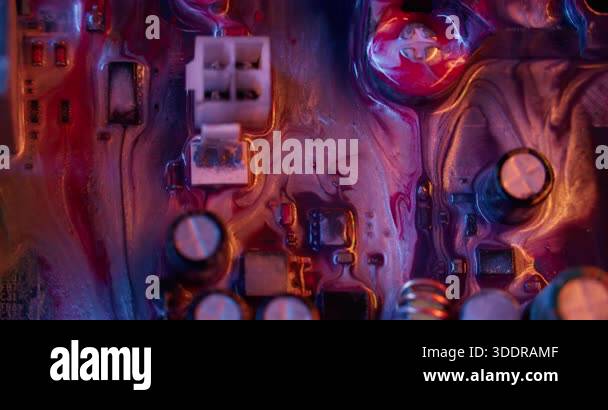 Paint drip. Electronic board. Defocused orange red neon colorful bright ...