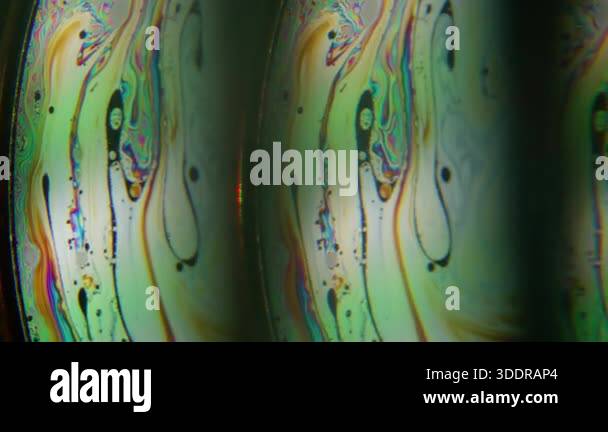 Fuel ink blur. Colorful flare. Gasoline paint floating on dark black ...