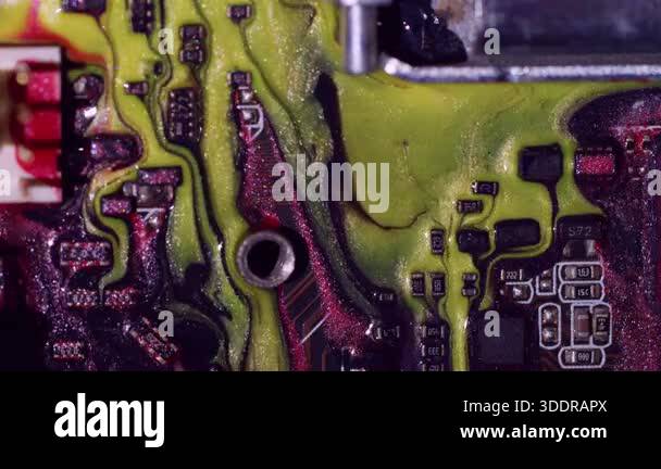 Paint drip. Processor chip. Defocused yellow purple red color digital ...