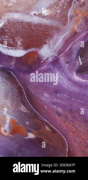 Vertical video. Melting fluid. Ice texture. Blur purple orange blue ...