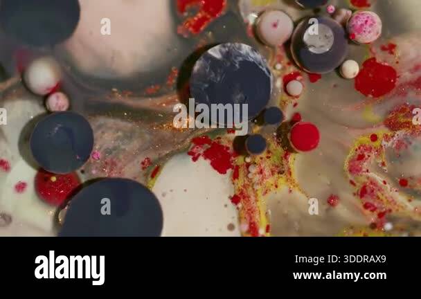 Dye splatter. Vibrant bubbles. Defocused purple yellow red colorful ...